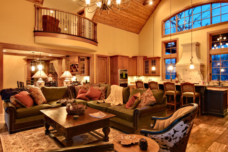 Open plan kitchen and two story den in lodge home | ACM Design ...