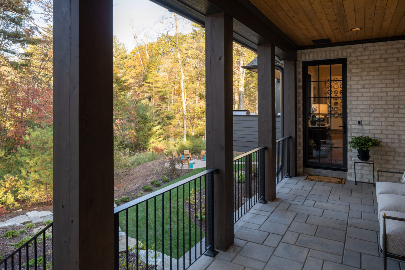 Breezeway from three car garage to main home. Breezeway with seating ...